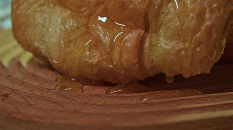 Honey Maple Syrup Or Molasses Drip Slowly And Deliciously From The