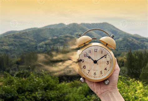 The Concept Of Leaving Time Old Hours In Hands Old Alarm Clock
