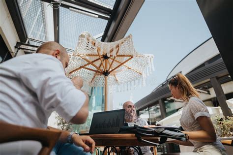 Startup Team In Outdoor Business Meeting Discussing Brainstorming And Analyzing Strategies