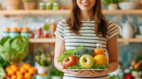 Premium Photo Smiling Woman Holding Plate Of Fresh Fruits And