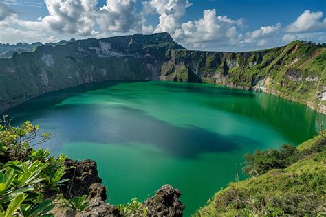 Majestic Volcanic Crater Lake With Emerald Green Water Surrounded By