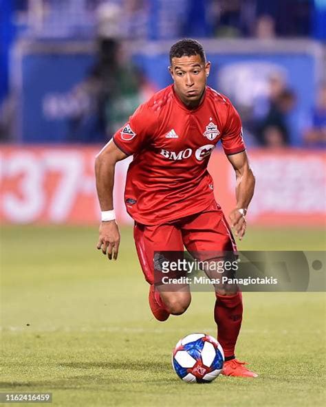 Justin Morrow Of Toronto Fc Runs The Ball Against The Montreal Impact