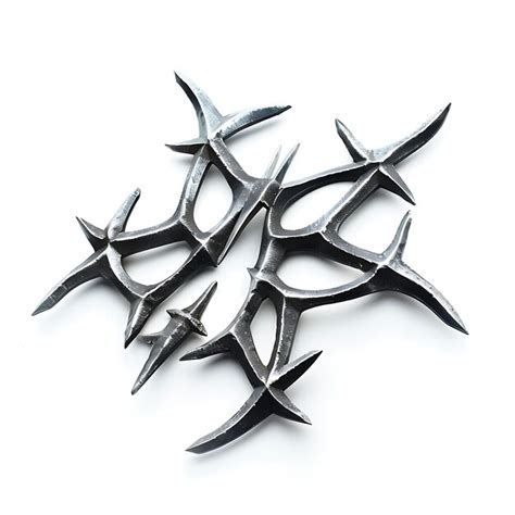 Premium Photo Fearsome Spiked Steel Caltrops Featuring A Menacing