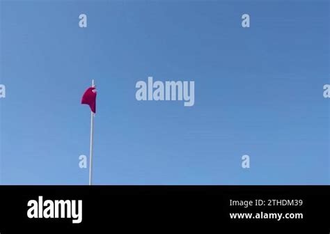 Red Flag Against The Blue Sky Dangerous For Swimming Storm Warning