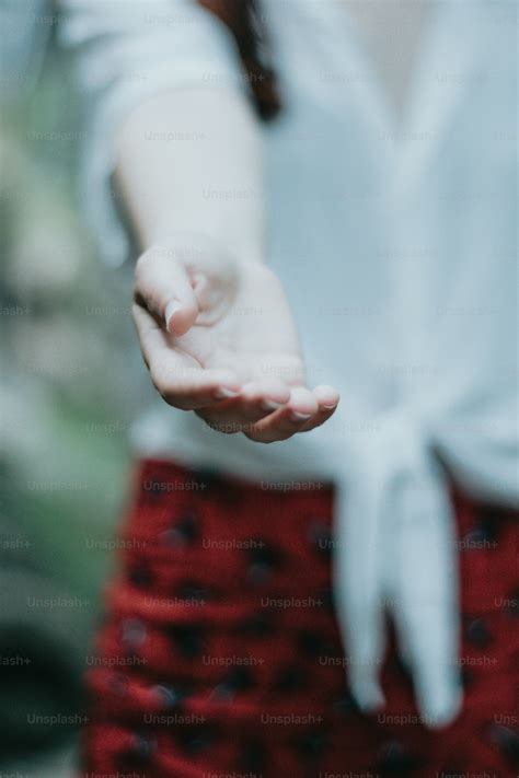 A Close Up Of A Person Holding Out Their Hand Photo Help Image On