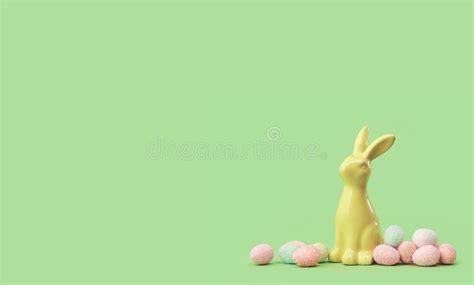 Easter Bunny With Tiny Eggs Sweets On Green Background Stock Image