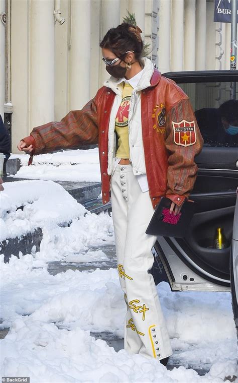 Bella Hadid Shows Off Her Abs As She Frolics Through The Snow In Pants
