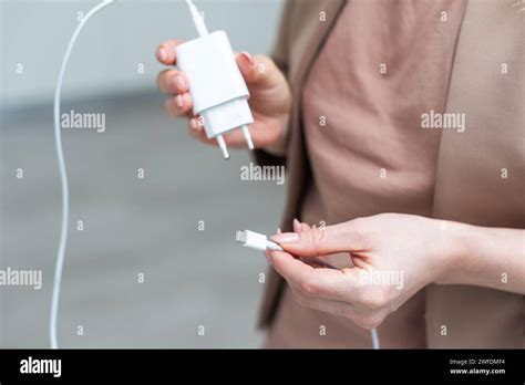 Woman Holding Electrical Adapter Hand Holding Charger Stock Photo Alamy