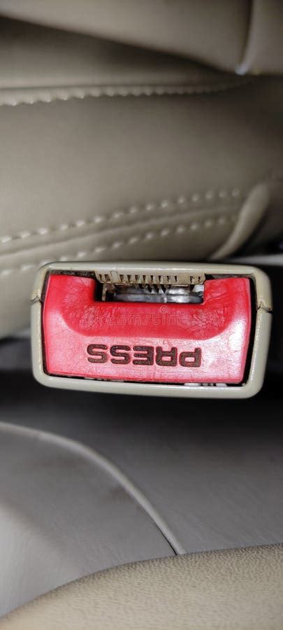 Car Seat Belt Click Lock In The Front Seat Car With A Red Button With A Press Letter Stock Image