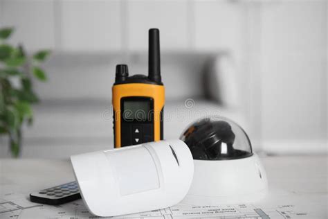 Cctv Camera Remote Control Movement Detector And Walkie Talkie On Building Plan Indoors Home