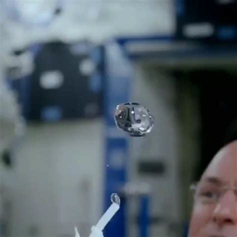 Astronaut Dissolves Effervescent Tablet In Water On The Iss R