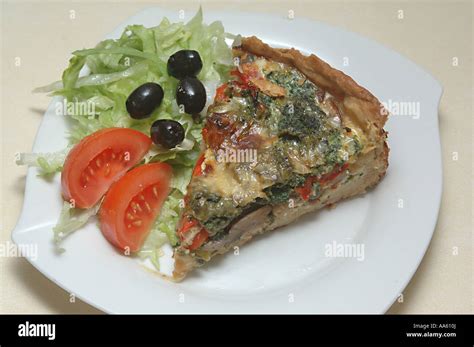 Vegetable Pie With Spinach Red Peppers And Mushrooms With Black Olives