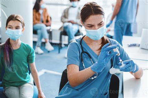 Vaccination And Immunization Concept Woman Nurse Drawing Medication