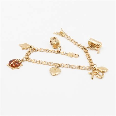 Armband Bismarck Guld 18k 121g Längd 18cm Bredd 4mm Med Sex Berlocker