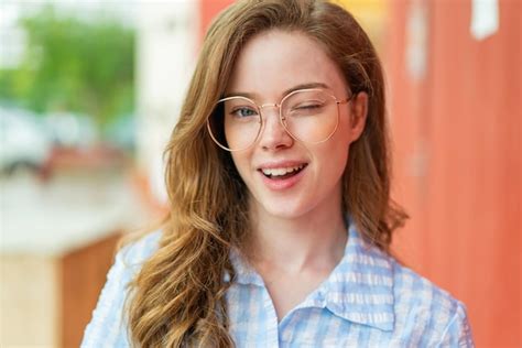 Premium Photo Young Redhead Woman At Outdoors With Glasses And Happy