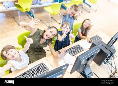 Teacher And Students Having Fun At E Learning Class At School Stock