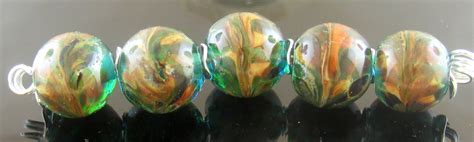 Handmade Teal Wrapped In Silver Foil And Decorated With Multi Colored Frit Raked Round Lampwork