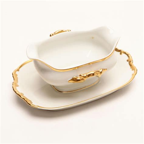 Assorted Gold And White Dinnerware Featuring Limoges And Royal