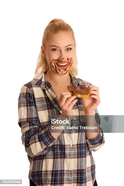 Young Blond Woman Eating Breakfast Bread And Nougat Spread Isolated Over White Background Stock