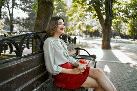 Woman In Red Skirt In The Park On The Bench Outdoors 23755729 Stock