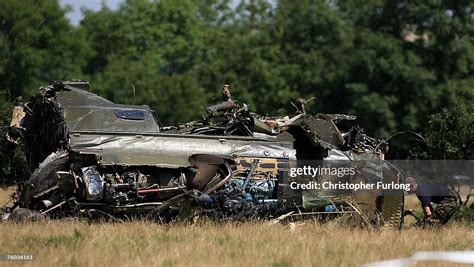 Royal Air Force Personnel Inspect The Wreckage Of A Puma Helicopter