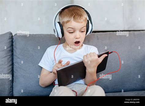 Excited Bright Boy Finding Something Interesting In The Internet Stock