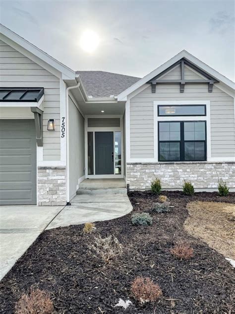 Light Grey House With Black Door