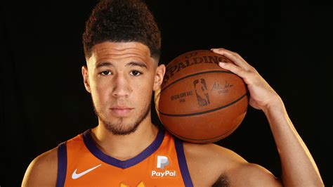 Devin Booker Leads Phoenix Suns In Intense Battle Against New Orleans Pelicans