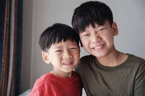 Premium Photo Asian Little Brother And Big Brother At Home Happy