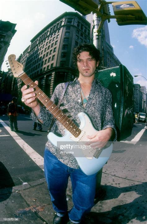 Guitarist Doyle Bramhall Ii Appears With His Blue Fender Guitar In A