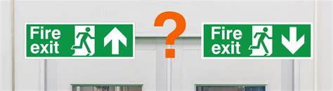 Fire Exit Signs Up Or Down Arrow Above A Doorway