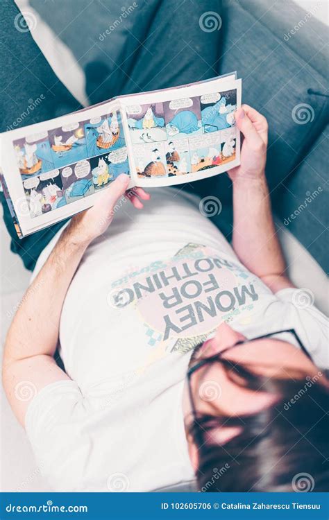 Young Man Reading A Moomin Book Editorial Photo Image Of Colorful