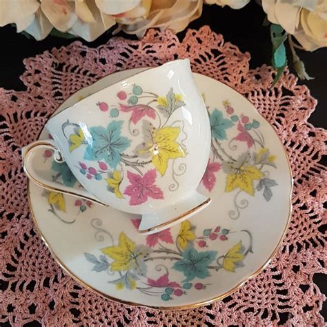 Vintage Charles Amison Stanley Bone China Tea Cup And Saucer Pink Blue Yellow Leaves Mid Century