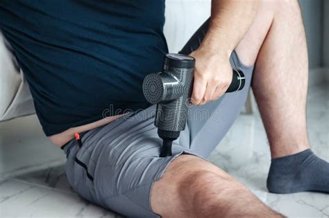 Gun Shock Vibration Percussion Massage Therapy Young Sporty Man