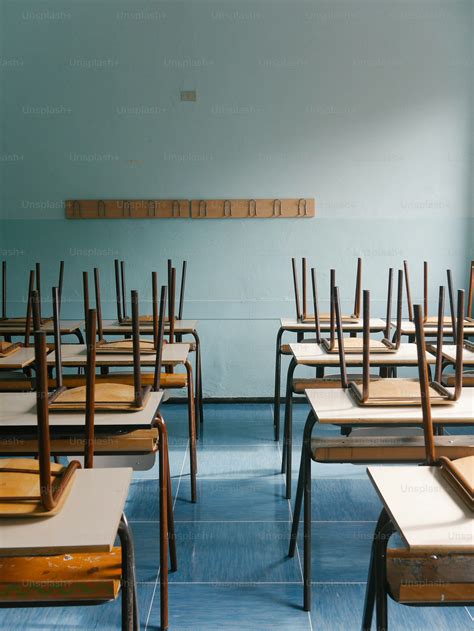 A Row Of Empty Desks In A Classroom Photo Classroom Image On Unsplash