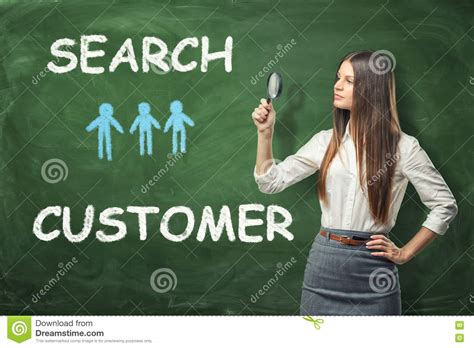 Beautiful Businesswoman Standing And Looking Through The Magnifying