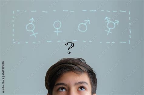 Gender Confusion In Teenager A Teen Boy Look Up At Gender Symbols Of