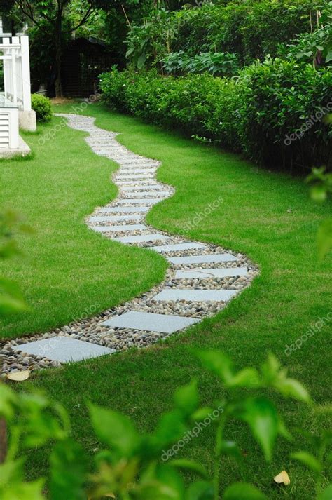 Garden Stone Path With Grass Growing Up Between The Stones Stone