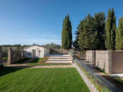 Microscape Uses Stone Filled Baskets To Update Italian Cemetery