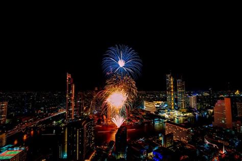Premium Photo Firework Display Over City Lit Up At Night High Angle