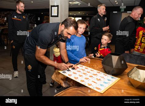 Mechelens Assistant Coach Frank Magerman Signs An Autograph During The
