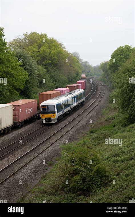 Chiltern Railways Class 165 Diesel Passing A Freightliner Train In