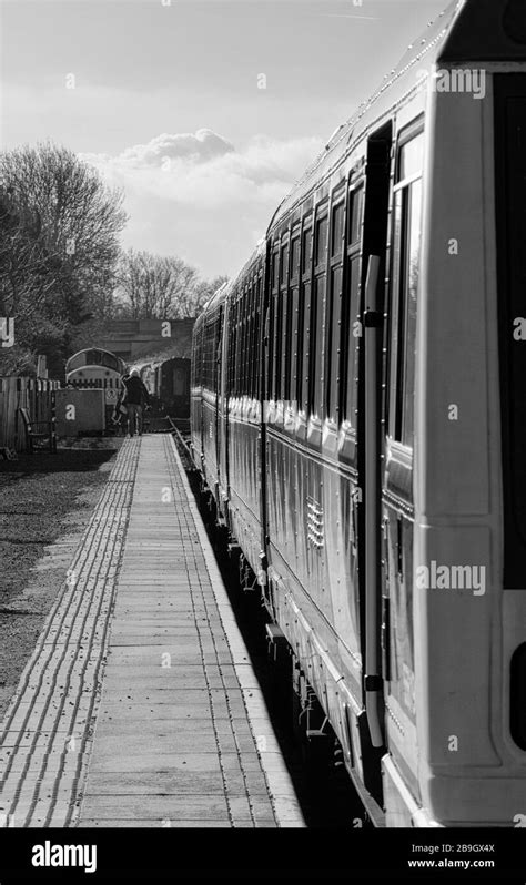 View Looking Down The Side Of Class 142 Pacer Trains 142060 142028