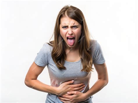 A Young Women Making A Disgusted Face With Her Tongue Out And Hand On