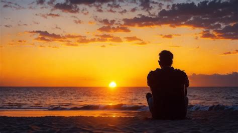 Premium Ai Image Man Watching Sunset At Beach
