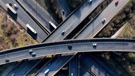 Vehicles At Rush Hour Driving Through A Freeway Intersection Aerial