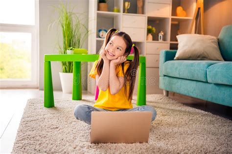 Photo Portrait Of Cute Small Girl Sit Floor Netbook Look Admire Empty