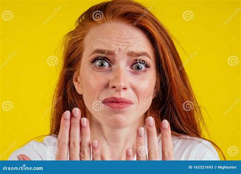 Close Up Portrait Of Nervous Unhappy Young Redhaired Ginger Woman