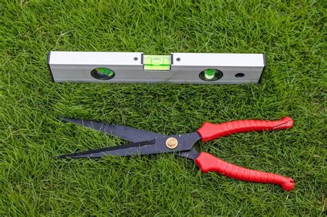 Premium Photo Trimmer And Level Tool On A The Grass