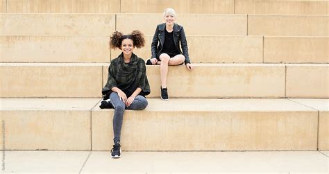 Beautiful Girlfriends Sitting On Stairts By Stocksy Contributor Guille Faingold Stocksy